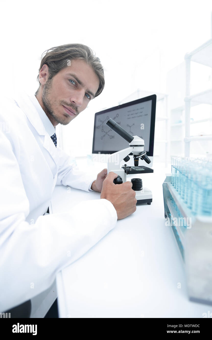 Student in biology using microscope in training class Stock Photo - Alamy