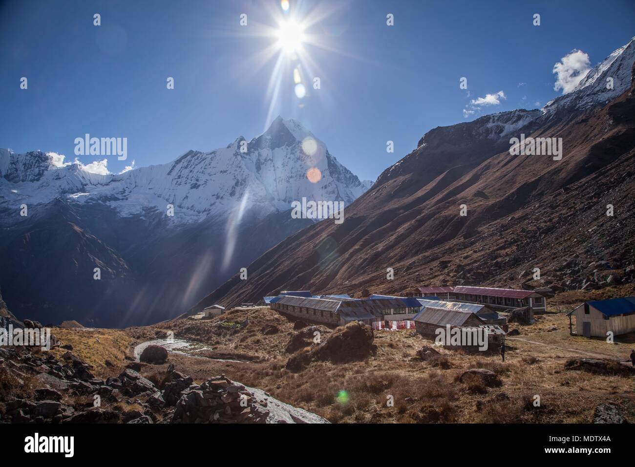 Sun shining over Annapurna basecamp. In the background is Machapuchare ...