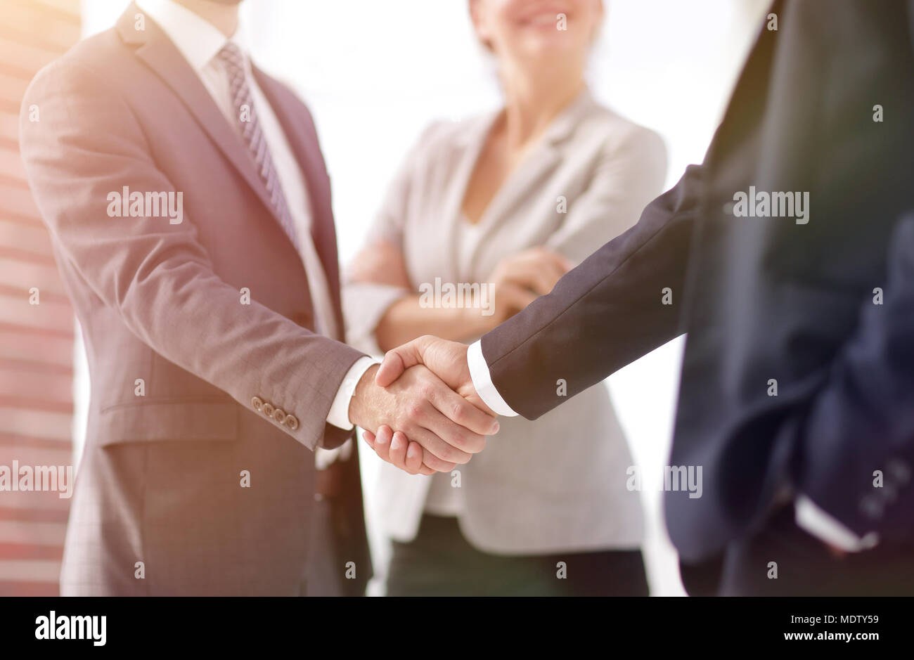 Two Business men shaking hands Stock Photo - Alamy