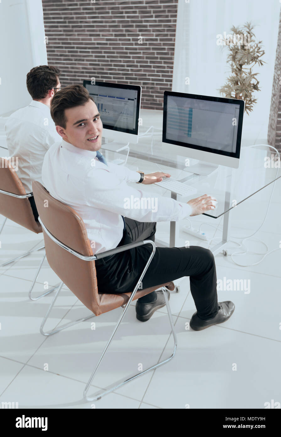 Boss sitting behind desk employees hi-res stock photography and images ...