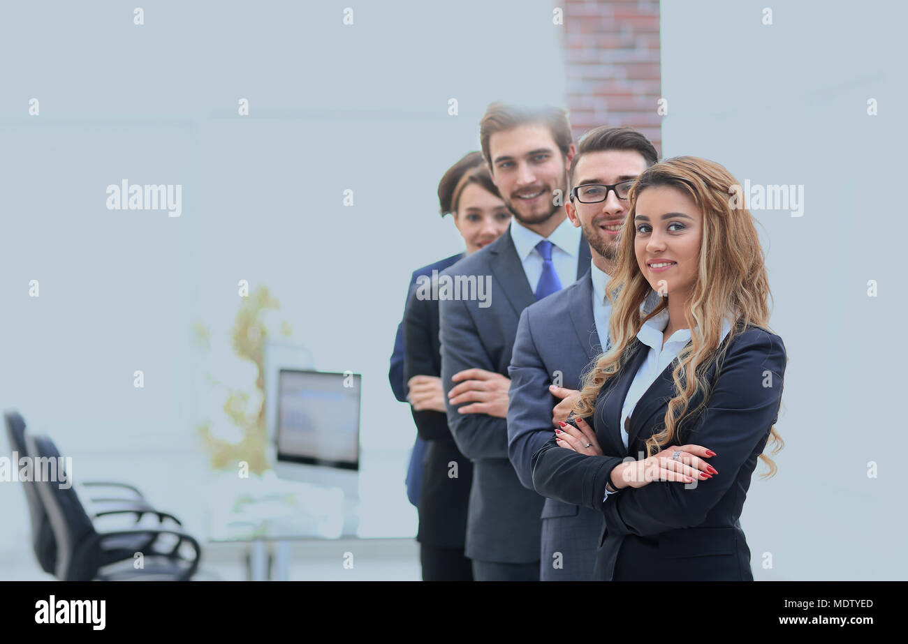 business team in the background of the office Stock Photo - Alamy
