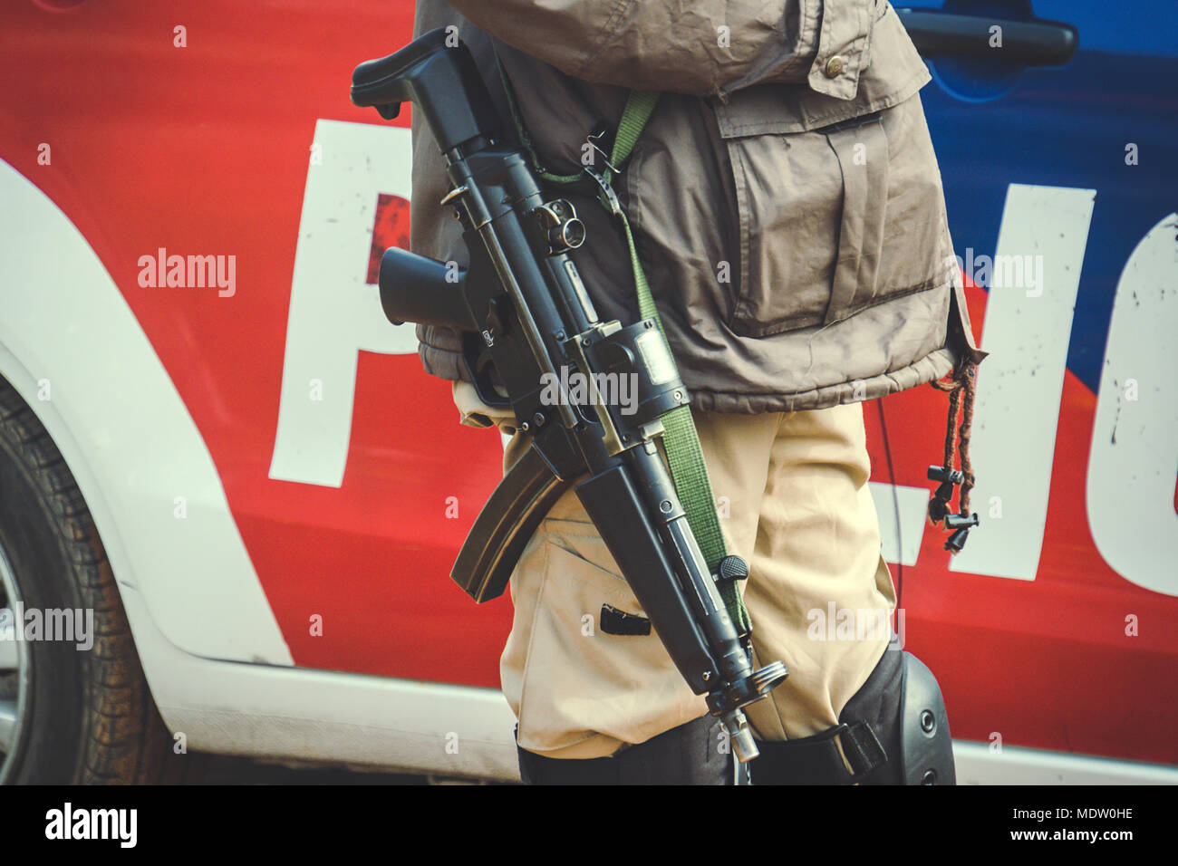 Special forces. machine gun on a COP's shoulder. commando stands with ...