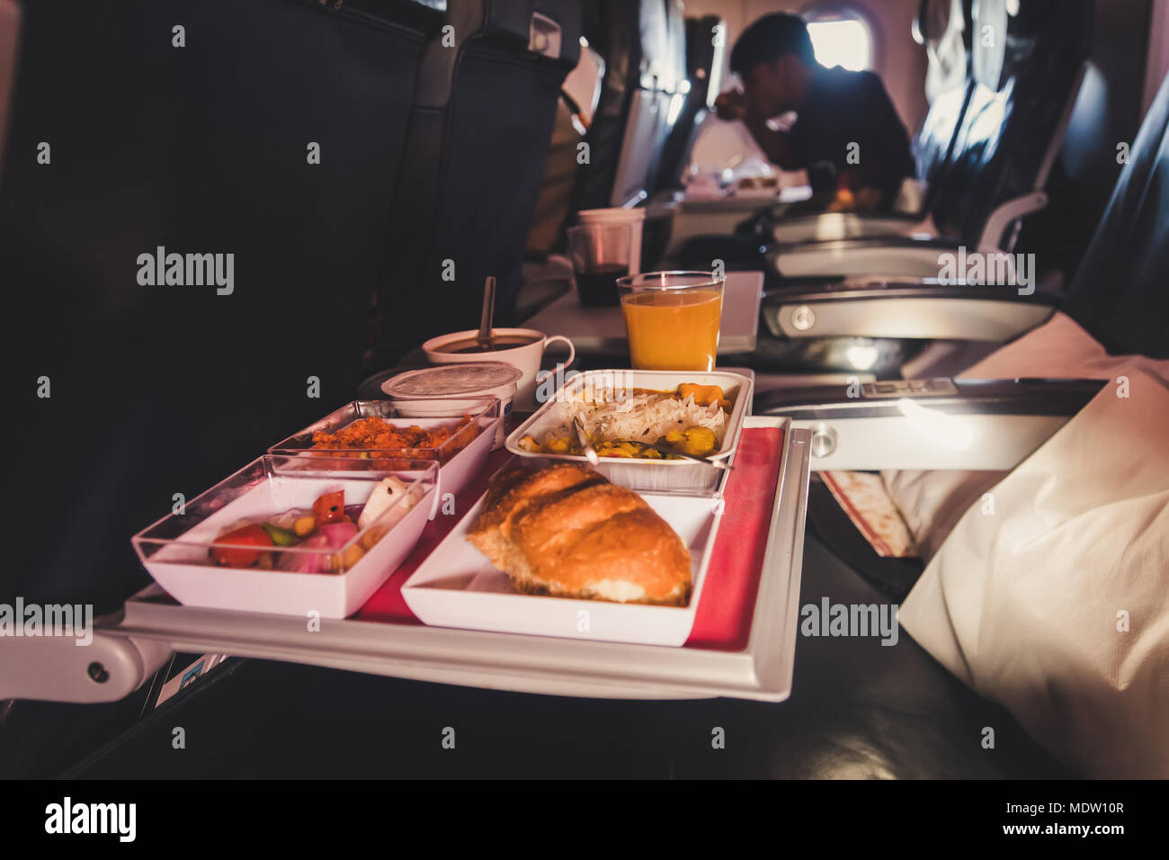 Tray of food. The passenger eats food on Board the plane on the ...