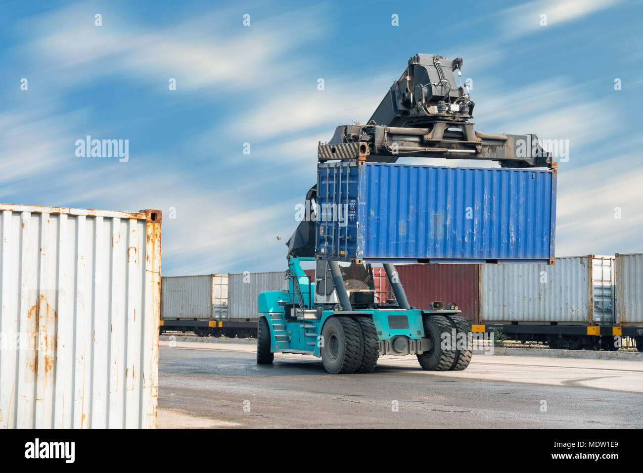 Container lifting truck in the storage yard Stock Photo - Alamy