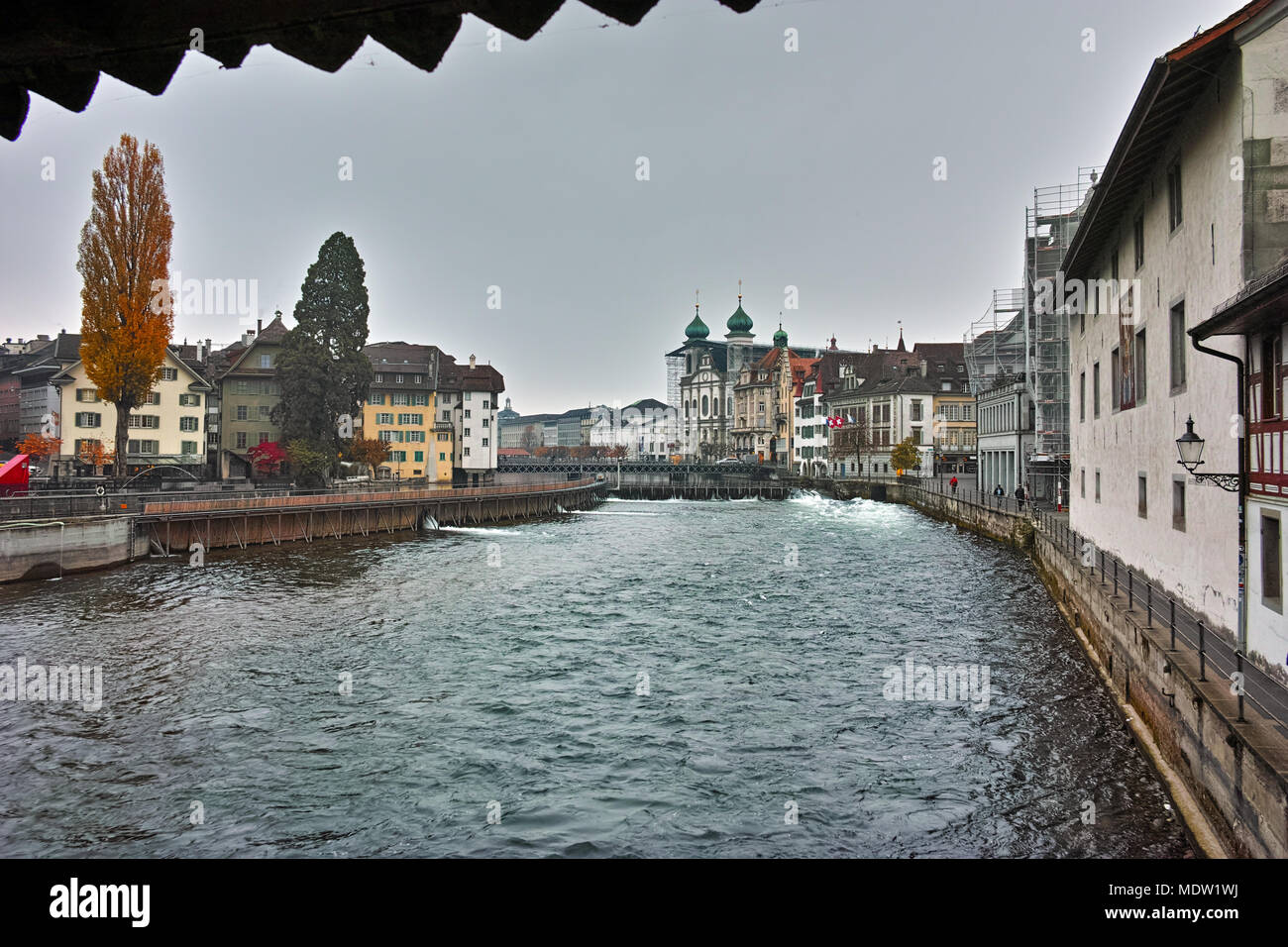 City of Luzern and reflection of old town in The Reuss River ...