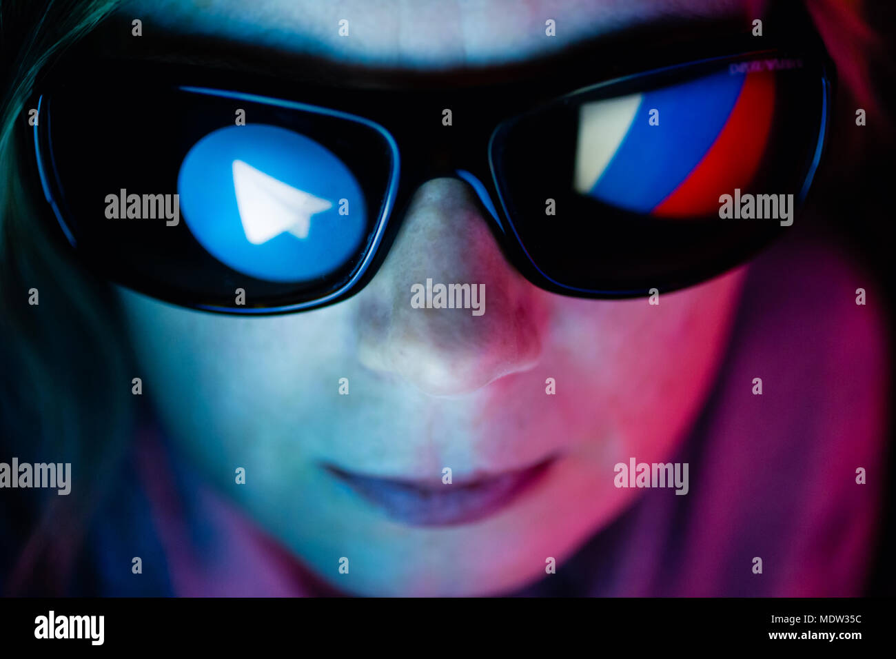 MOSCOW, RUSSIA - APRIL 17, 2018: A young pretty girl with spectacles in ...