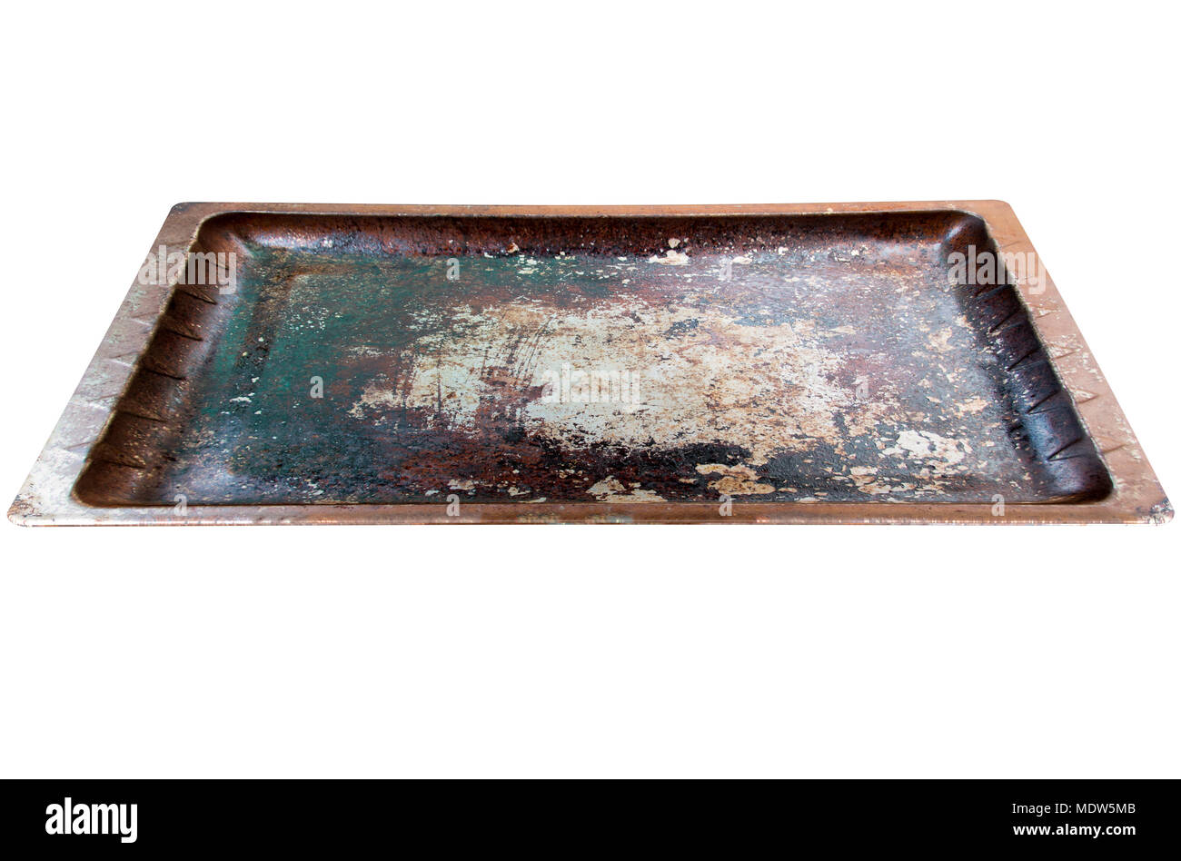 A regular flat worn and tarnished metal oven baking tray on an isolated ...