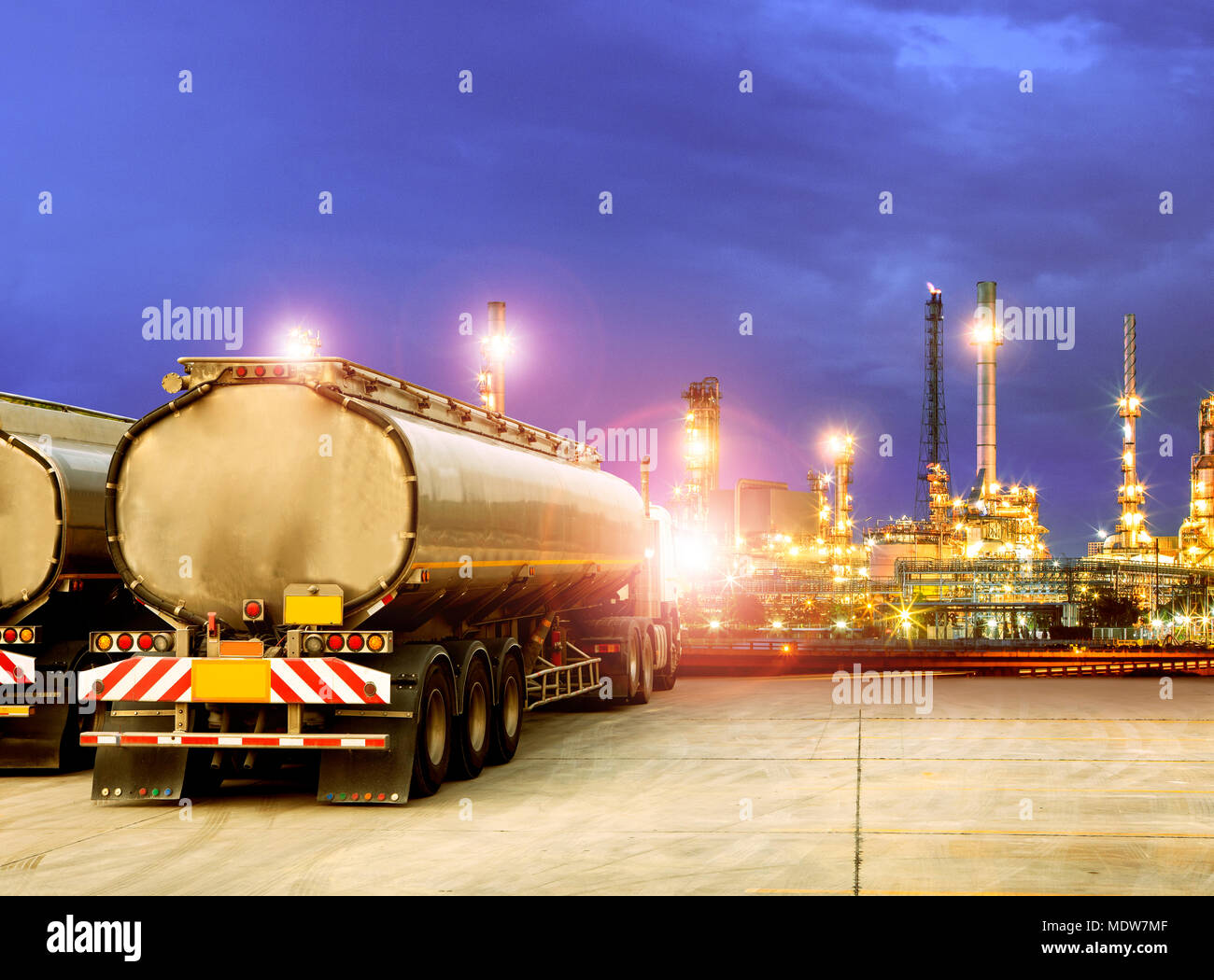 oil container truck and beautiful lighting of oil refinery plant Stock ...