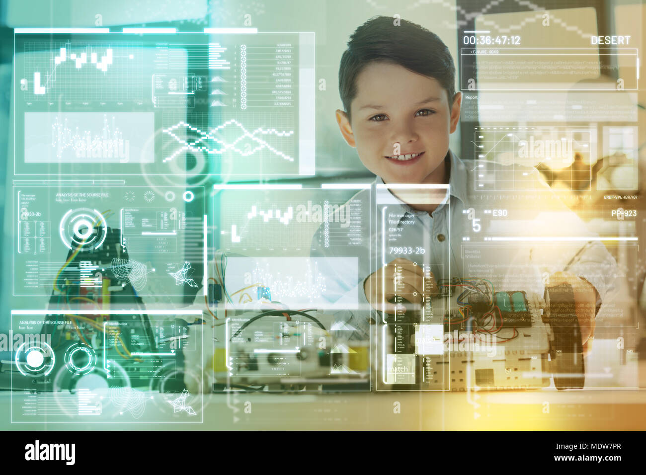 Clever child feeling glad while showing his amazing inventions Stock ...