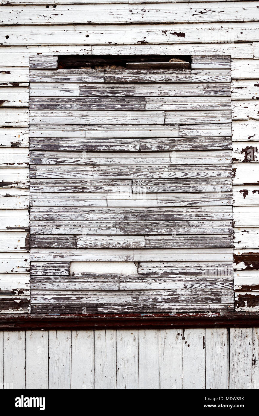 Weathered wooden plank house wall with boarded up window Stock Photo ...