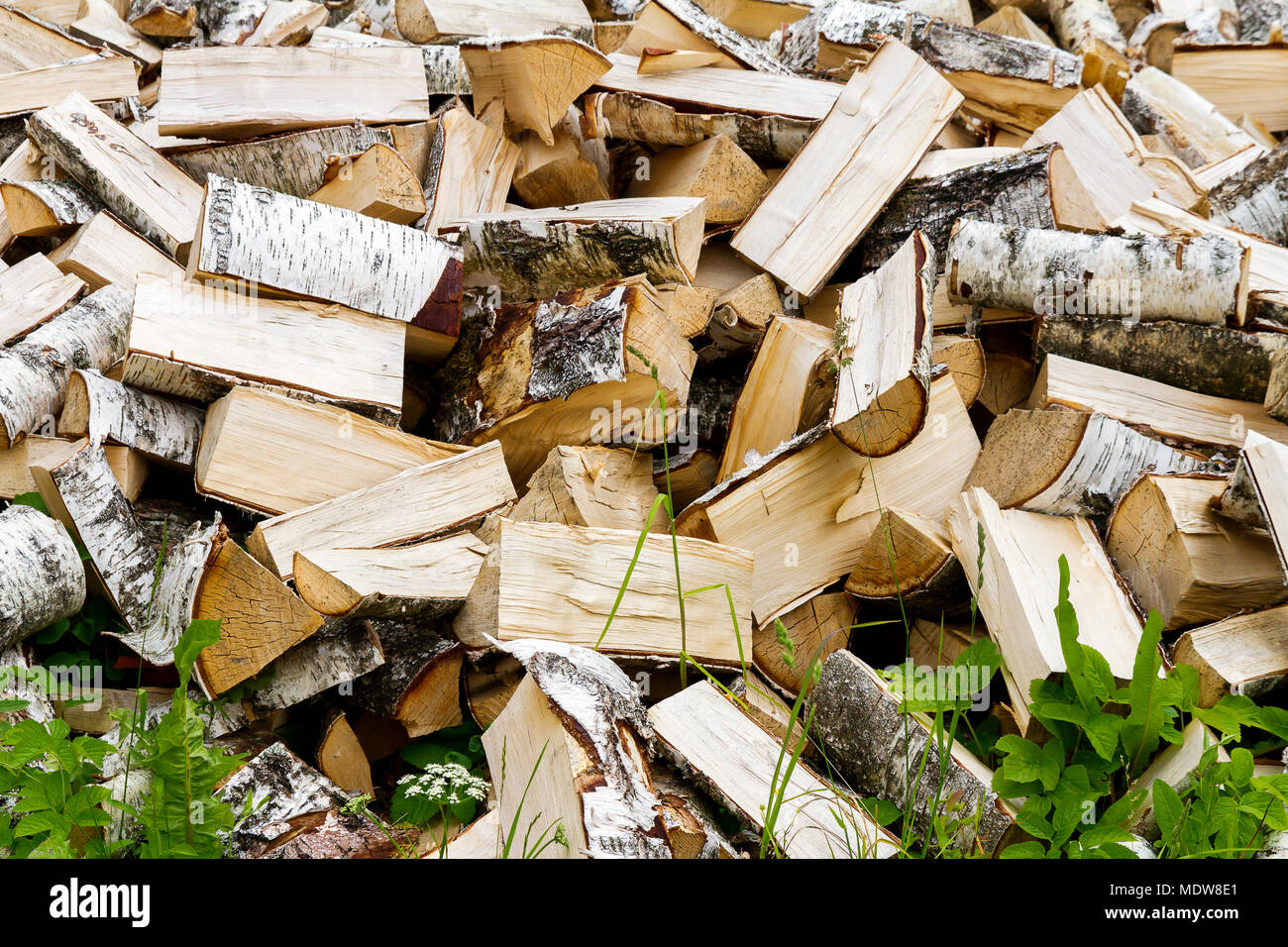 Chopped logs for winter fire. Pile of chopped fire wood prepared for ...