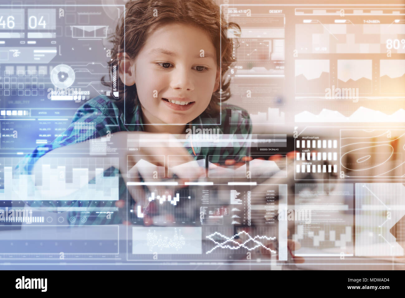 Cute boy smiling and feeling good while making a project Stock Photo ...