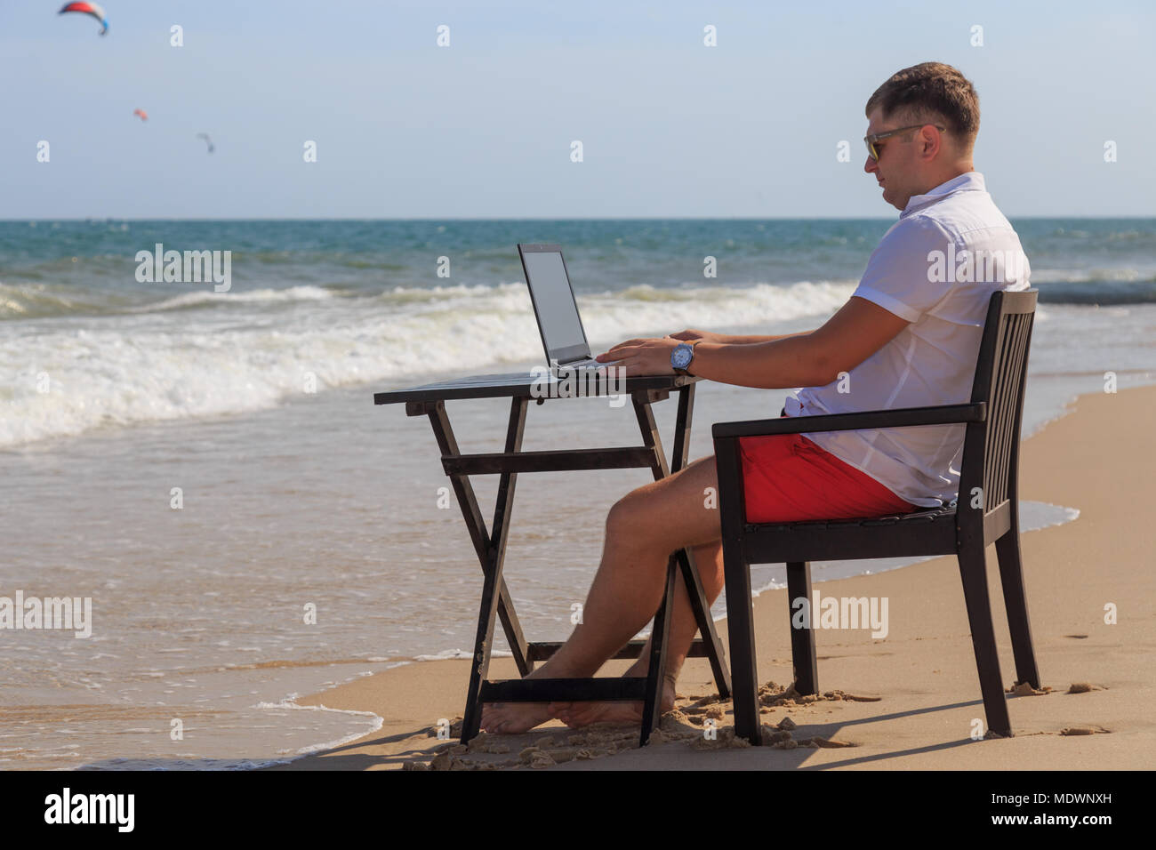 Business Man Working on Tropical Beach Stock Photo - Alamy