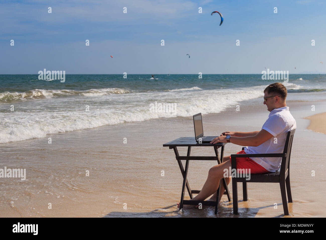 Business Man Working on Tropical Beach Stock Photo - Alamy