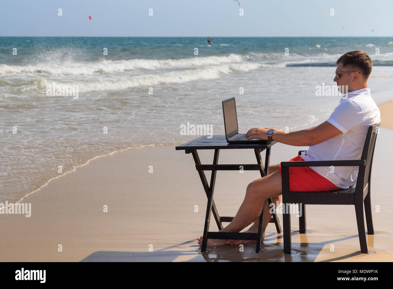 Business Man Working on Tropical Beach Stock Photo - Alamy