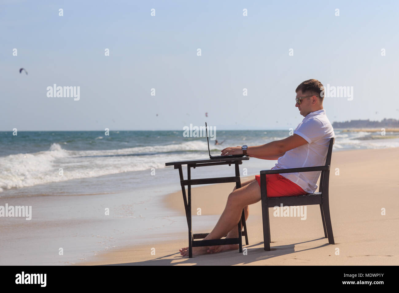 Business Man Working on Tropical Beach Stock Photo - Alamy