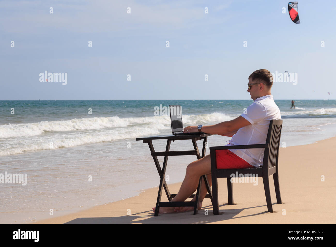 Business Man Working on Tropical Beach Stock Photo - Alamy