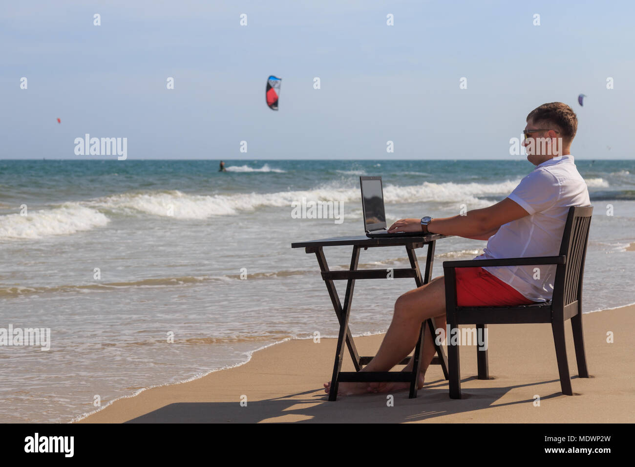 Business Man Working on Tropical Beach Stock Photo - Alamy