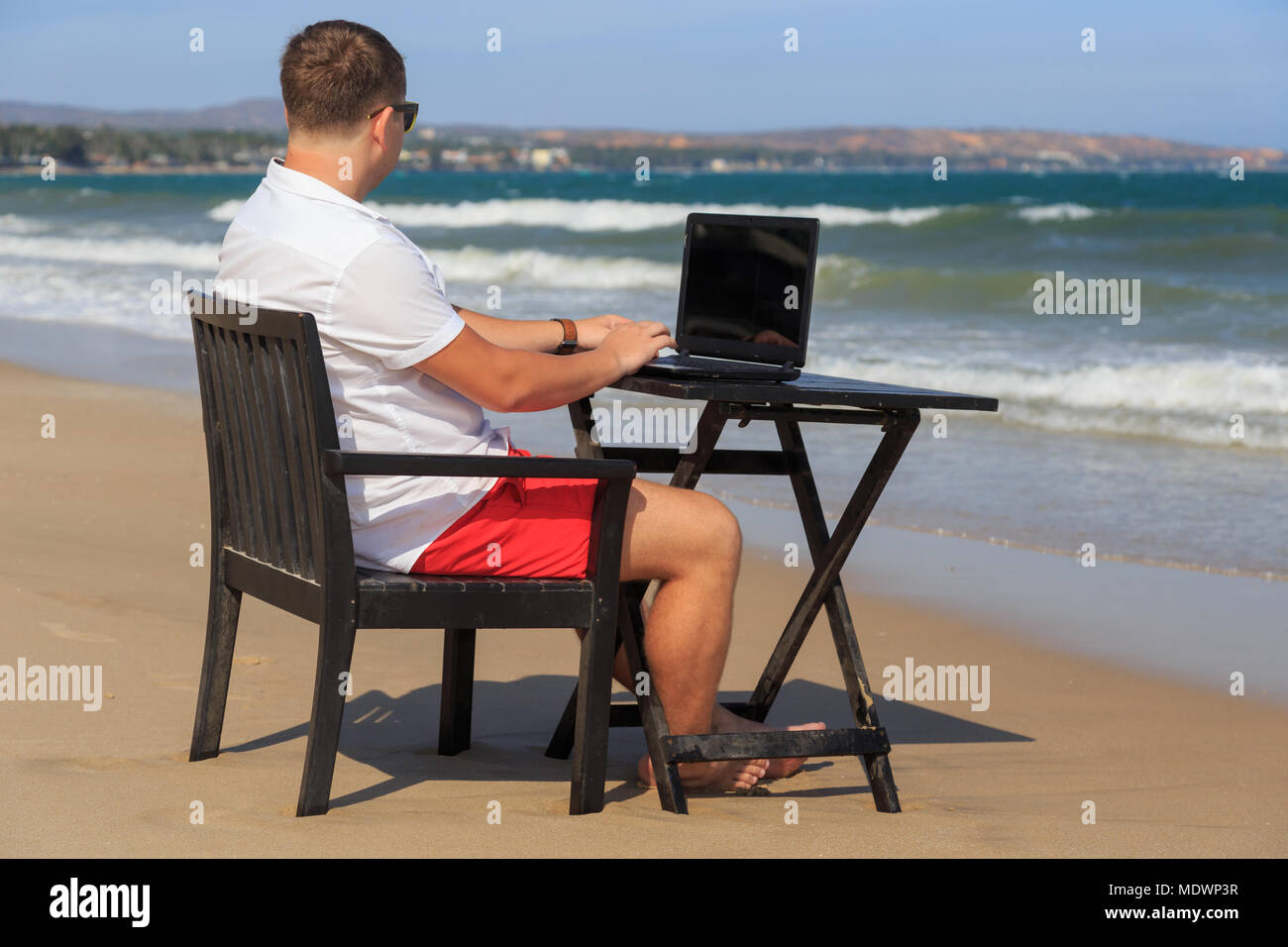 Business Man Working on Tropical Beach Stock Photo - Alamy