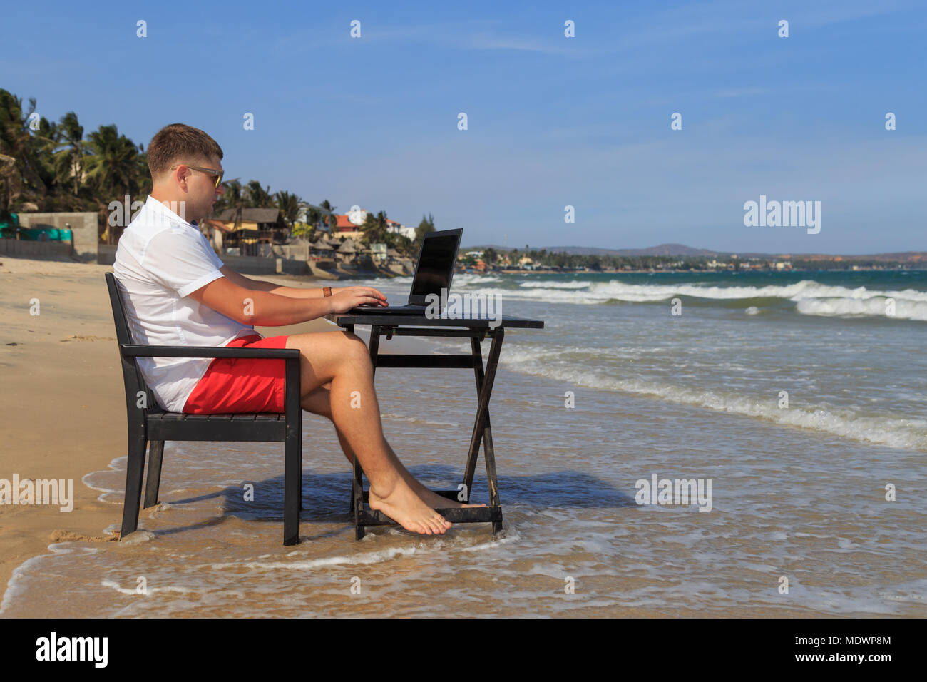 Business Man Working on Tropical Beach Stock Photo - Alamy