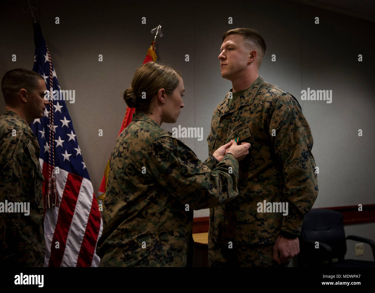 U.S. Marine Corps Lt. Col. Taunja M. Menke, center, commanding officer ...
