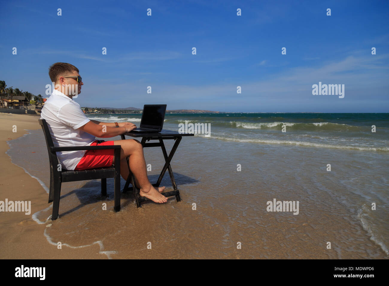 Business Man Working on Tropical Beach Stock Photo - Alamy