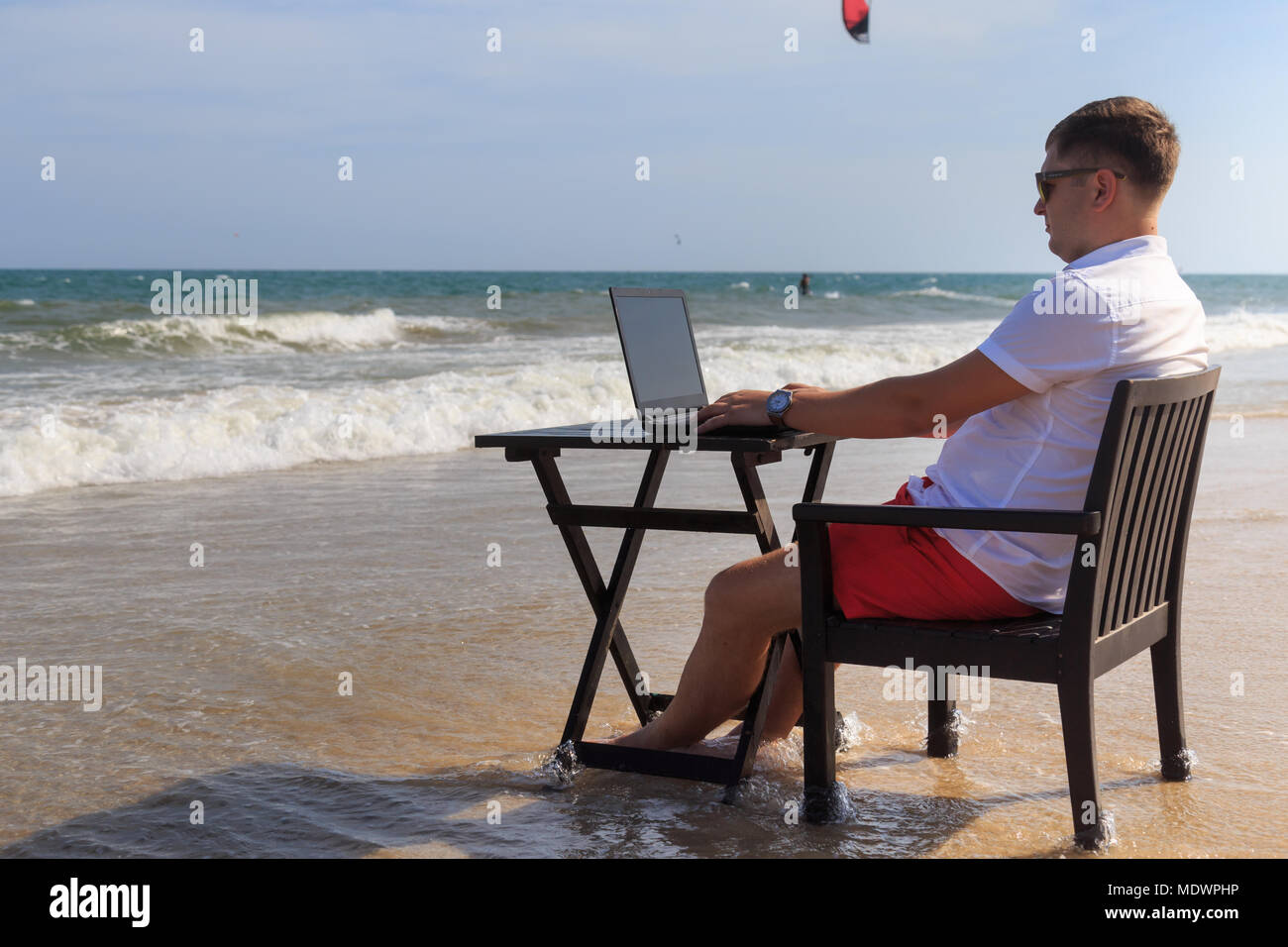 Business Man Working on Tropical Beach Stock Photo - Alamy