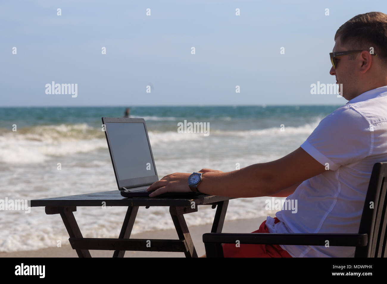 Business Man Working on Tropical Beach Stock Photo - Alamy