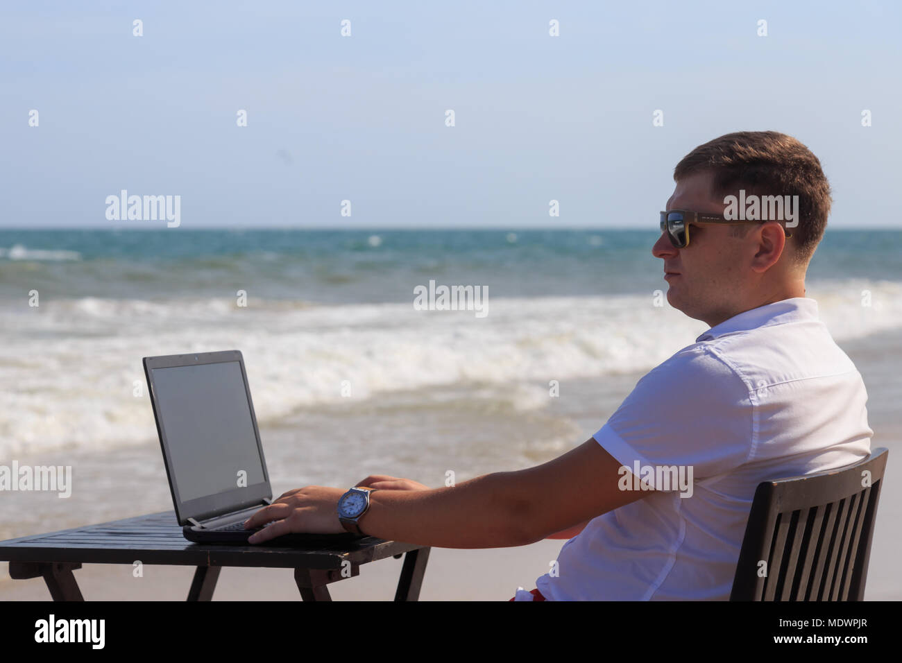 Business Man Working on Tropical Beach Stock Photo - Alamy
