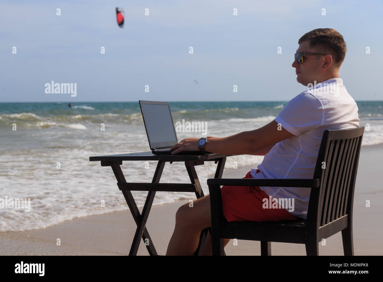 Business Man Working on Tropical Beach Stock Photo - Alamy