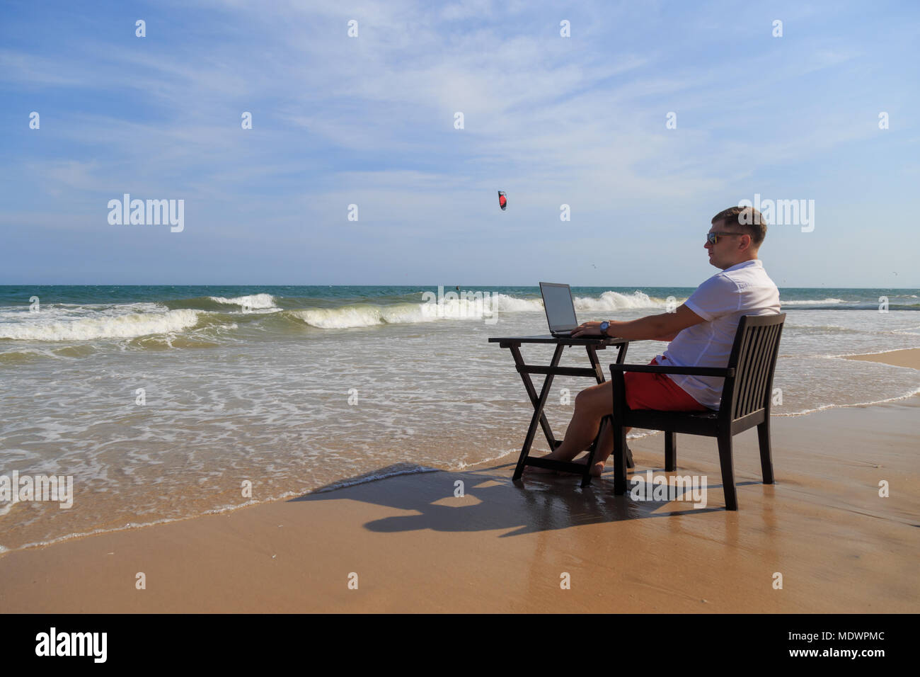 Business Man Working on Tropical Beach Stock Photo - Alamy