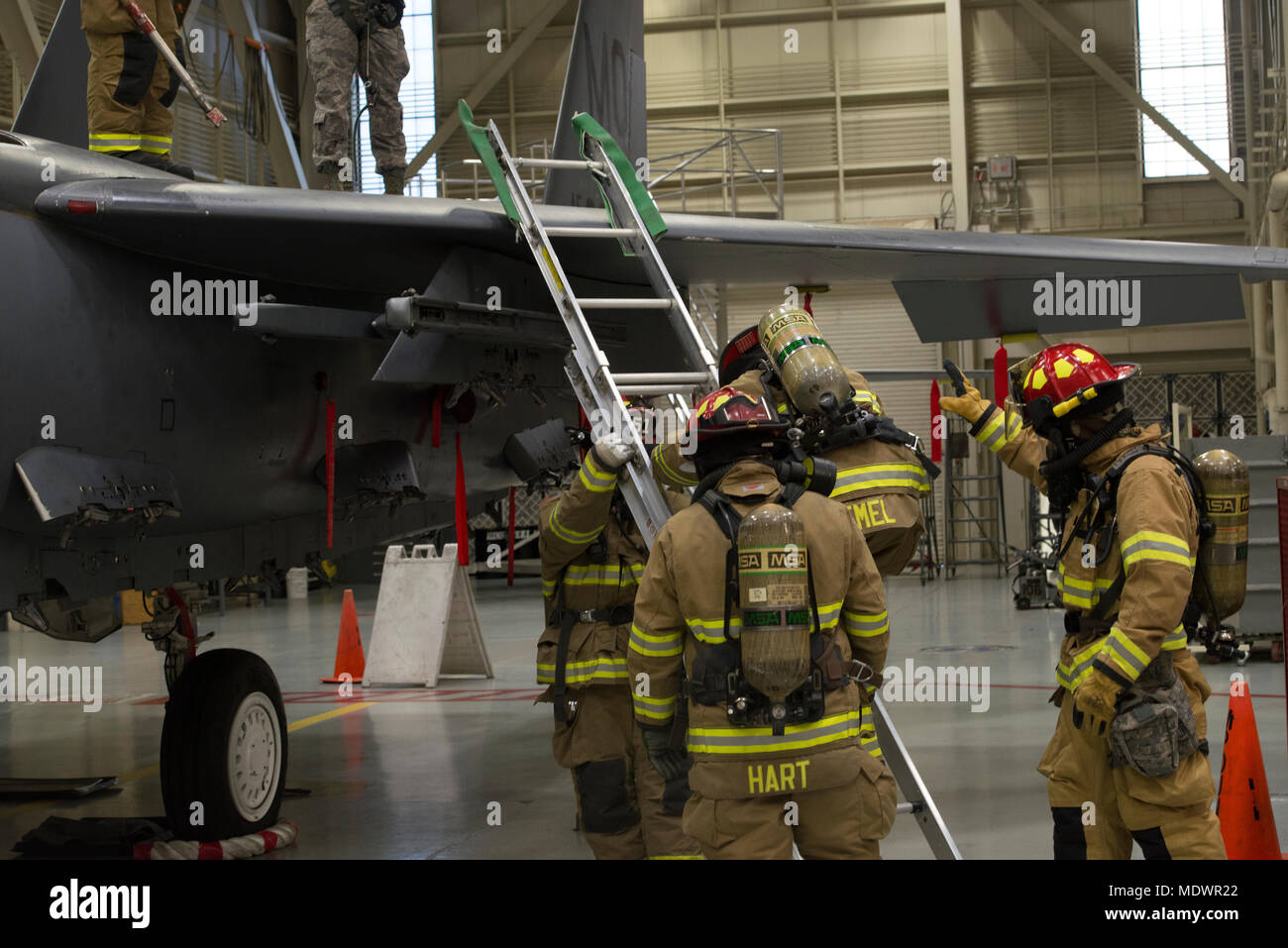 Airmen from the 366th Civil Engineer Squadron pull a ladder off of an F ...