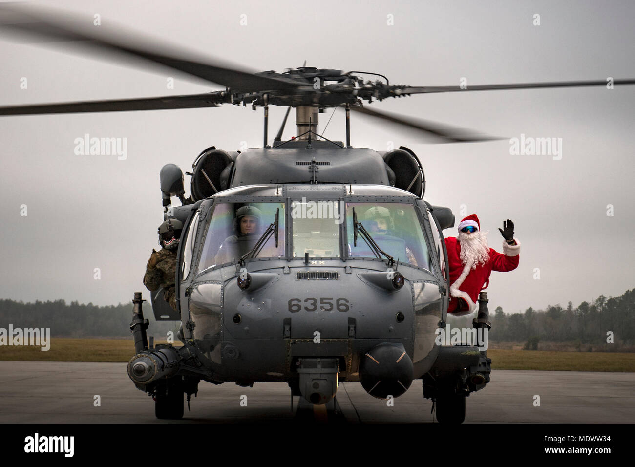 Santa poses with the crew of an HH-60G Pave Hawk from the 41st Rescue ...