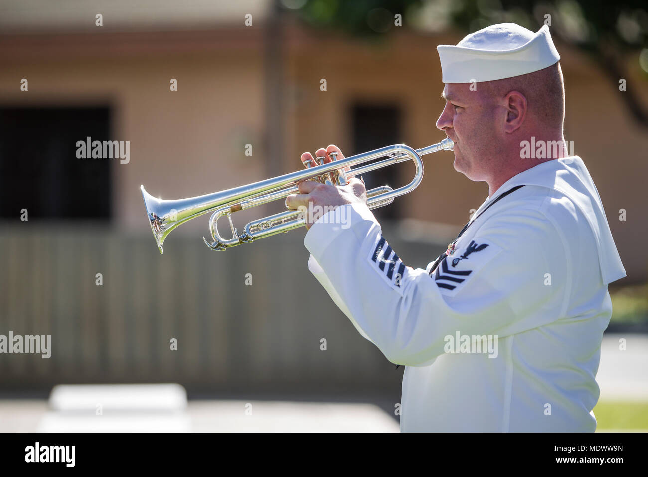 A Sailor plays taps during the 2017 USS Oklahoma Memorial Ceremony on ...