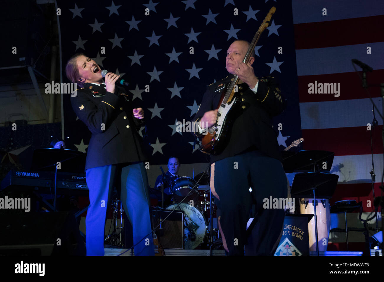 Spc. Kayla Winslow, vocalist, and Staff Sgt. Lonnie Thompson ...