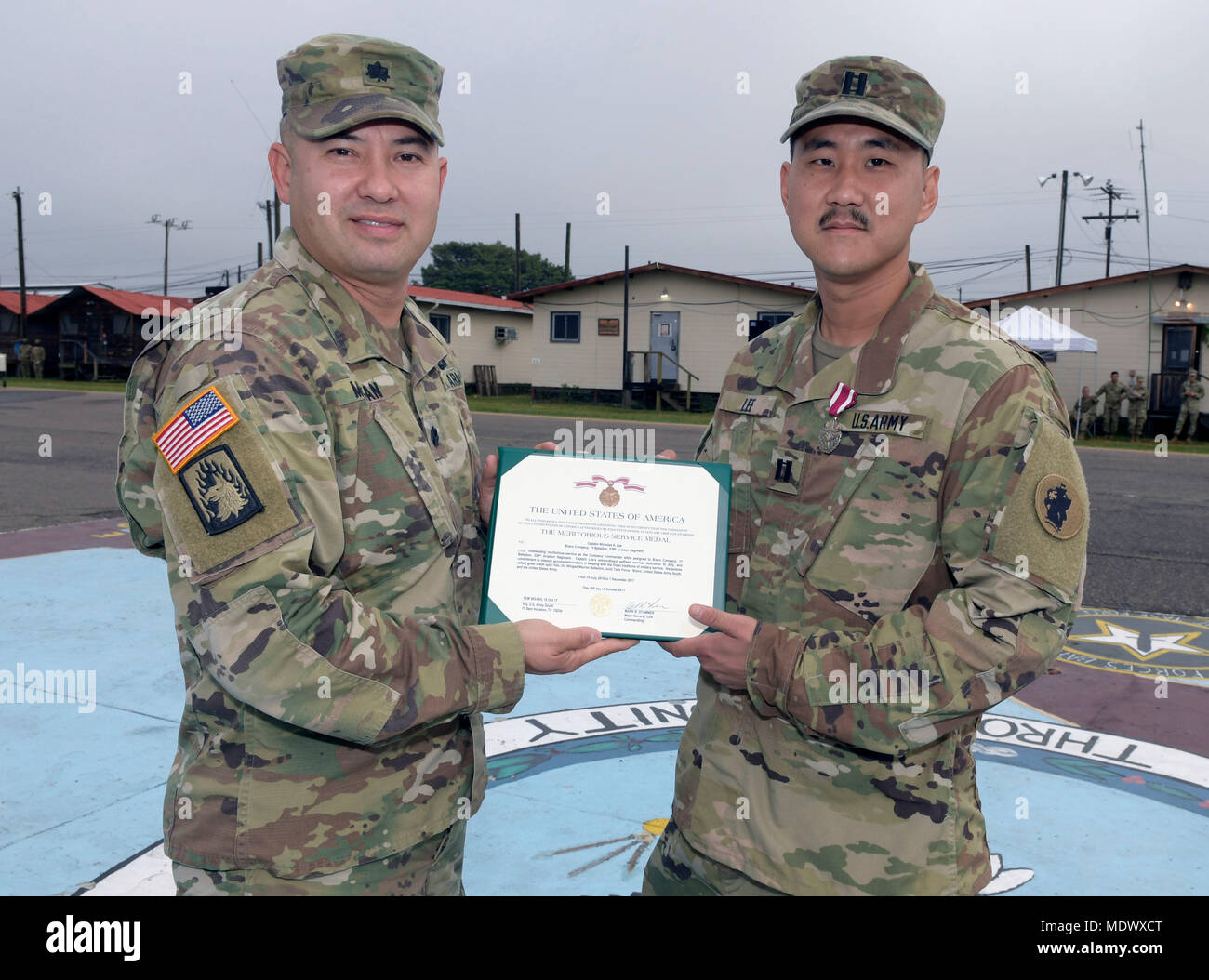 U.S. Army Capt. Nicholas K. Lee (right), outgoing Bravo Company, 1st ...