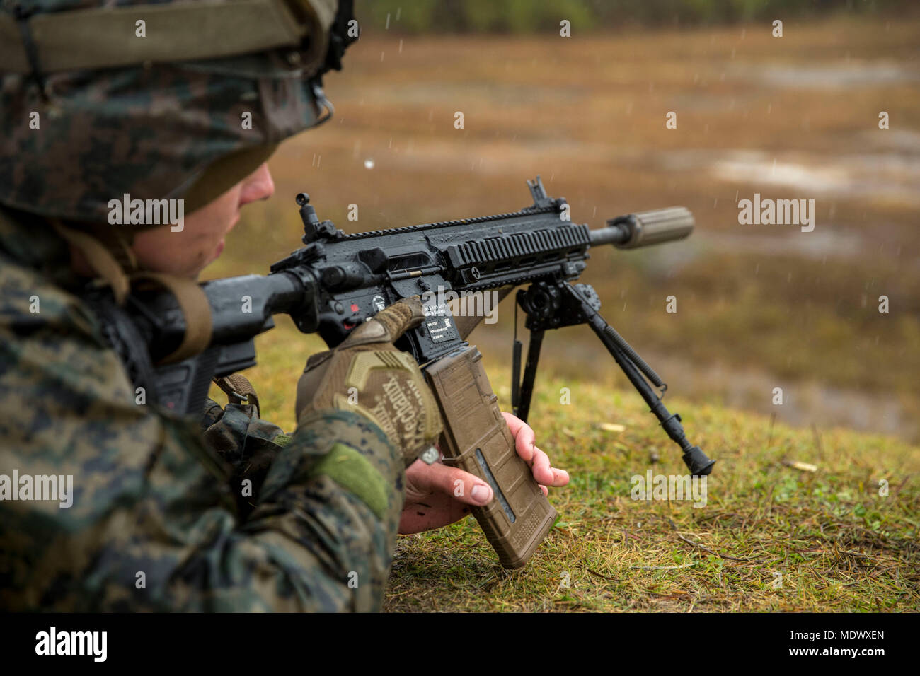 U.S. Marines with 3rd Battalion 8th Marine Regiment fire the M27 ...
