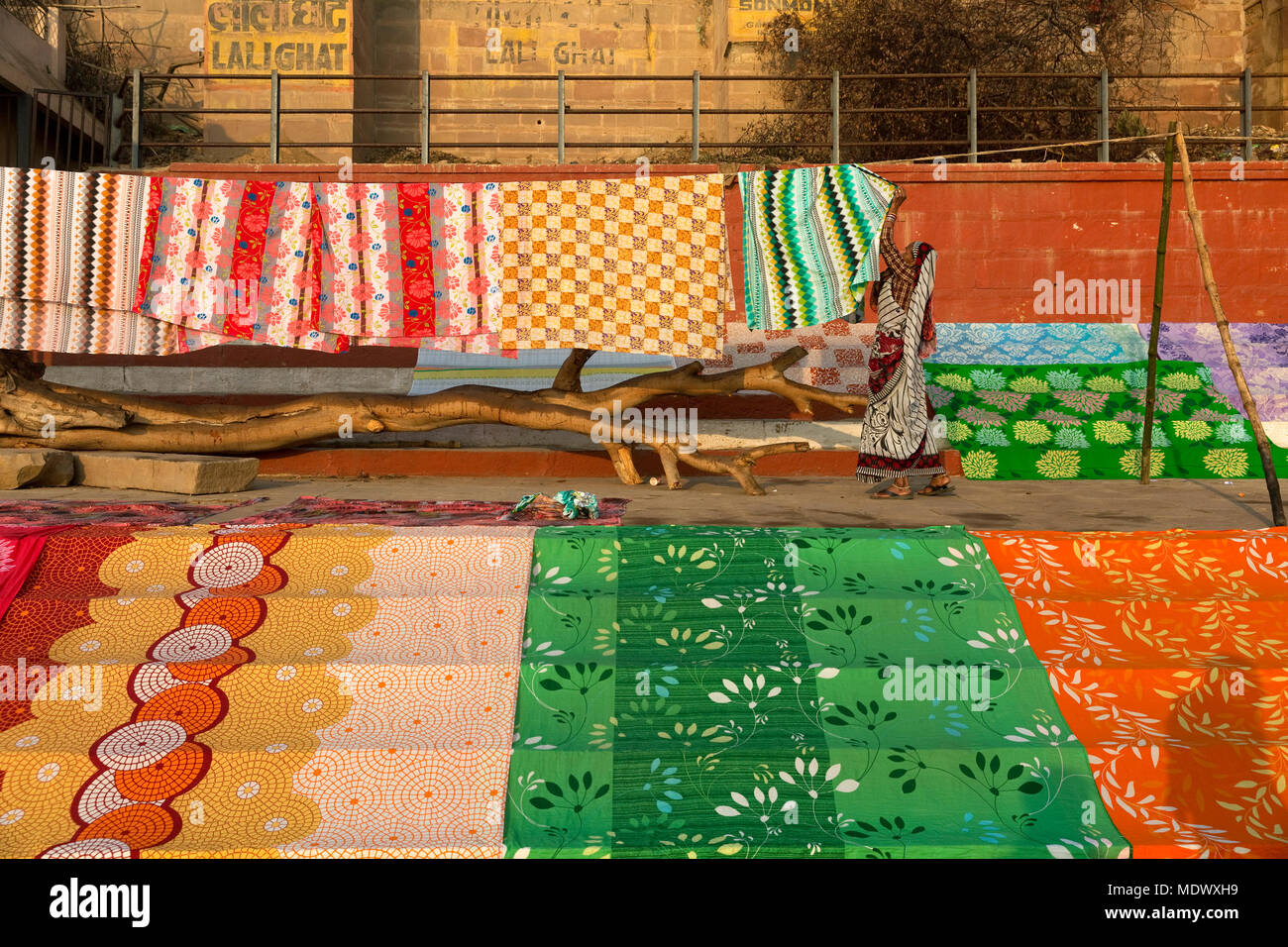 People drying vibrant, colourful Laundry on the Ghats of the Ganges in ...