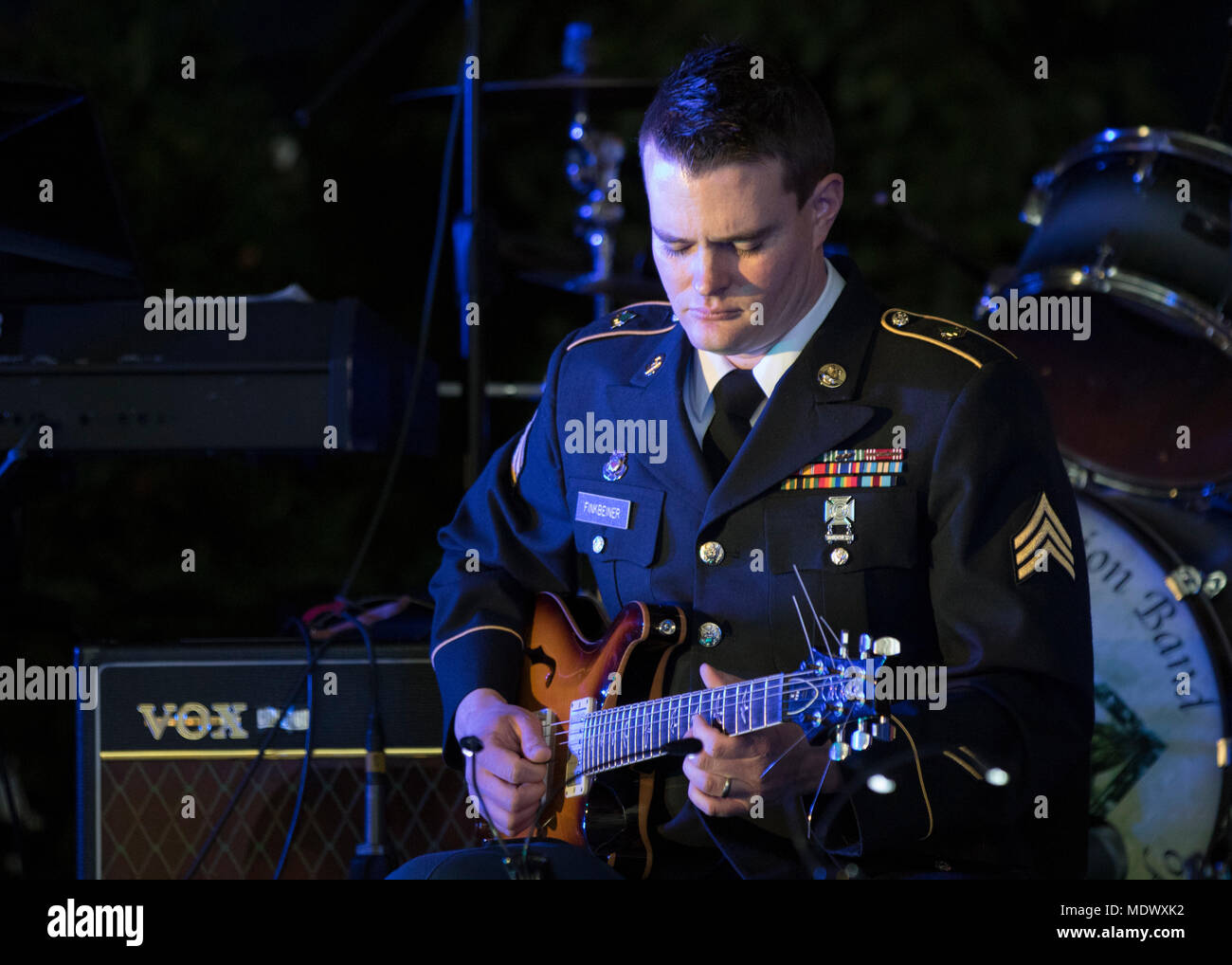 Sgt. Gregory Finkbeiner, guitarist with the 4th Infantry Division Band ...