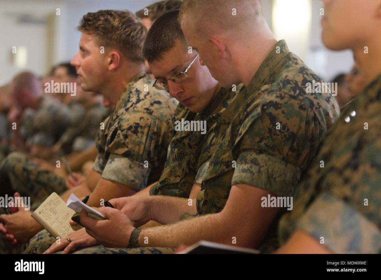 U.S. Marines stationed on Marine Corps Base Hawaii (MCBH) compare notes ...