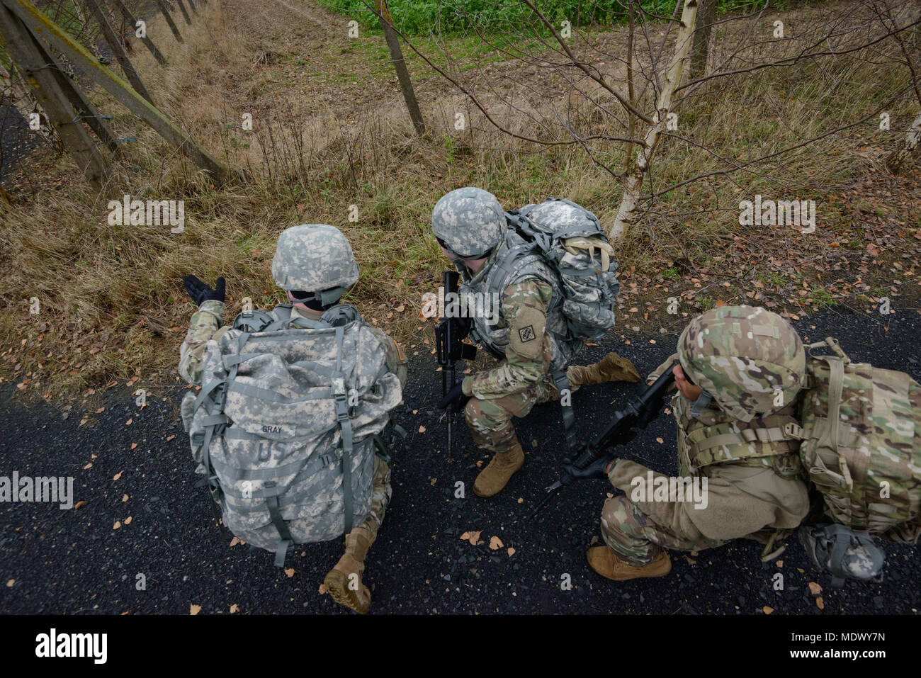 U.S. Army Spc. Jonathan Gray (right), assigned to the U.S. Army Network ...