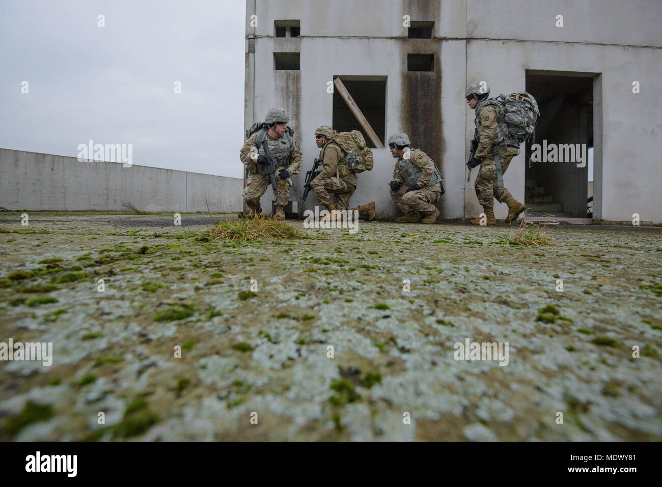 U.S. Army Spc. Jonathan Gray, right, assigned to the U.S. Army Network ...