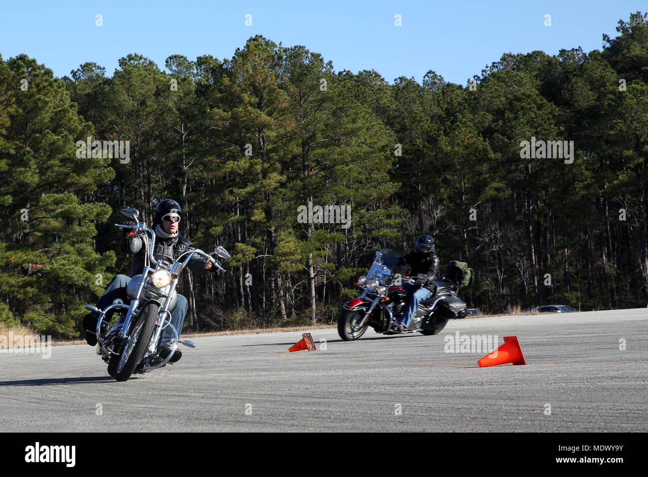 Motorcyclists complete familiarization laps around a training track ...