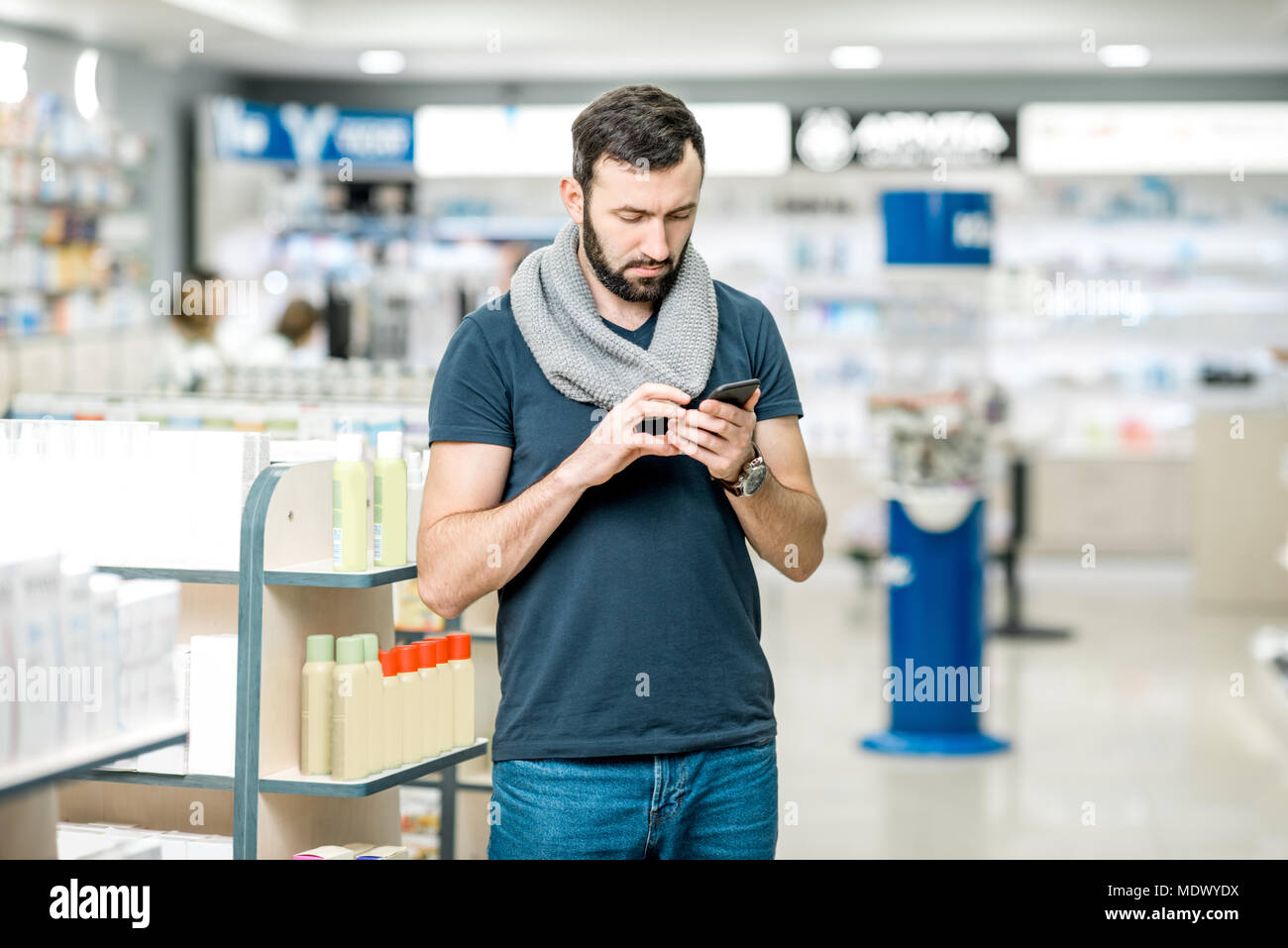 Man shopping in the pharmacy Stock Photo - Alamy