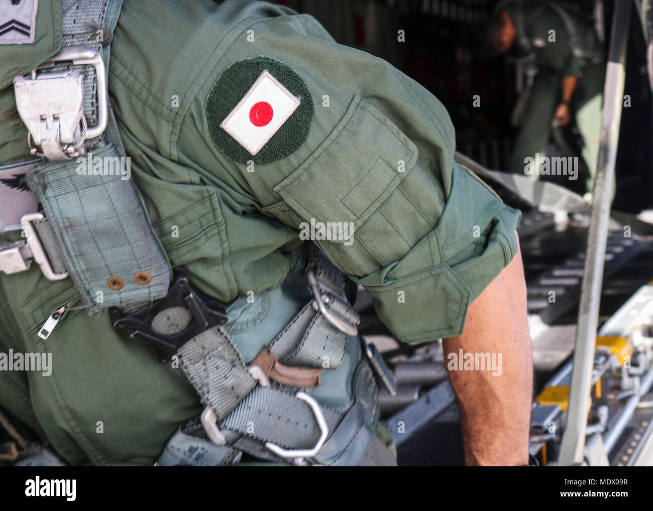 A loadmaster with the 1st Tactical Air Wing 401st Squadron performs a ...