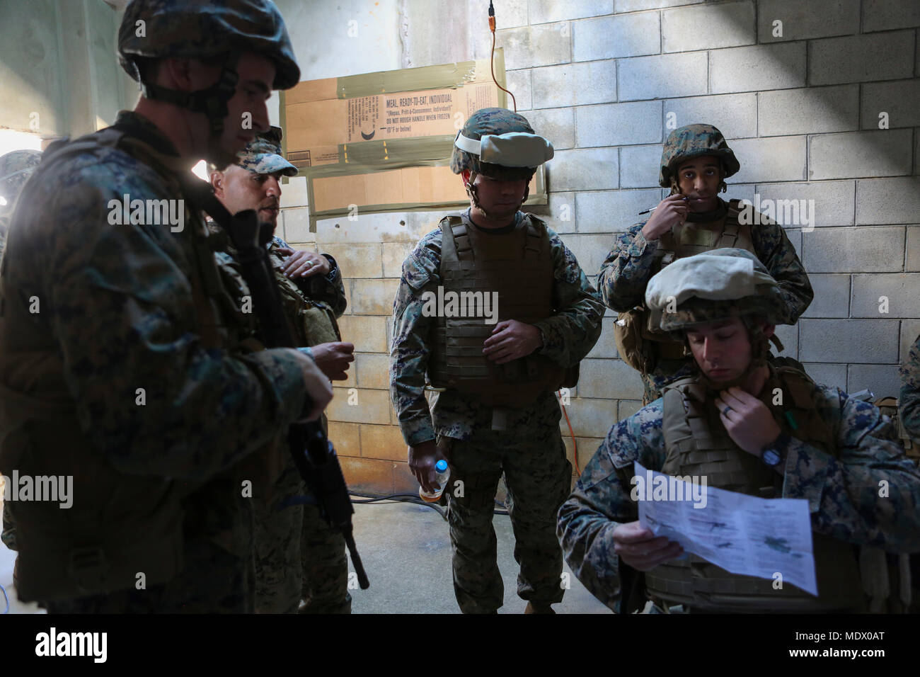 Marines with 3rd Marine Logistics Group Headquarters debrief during a ...