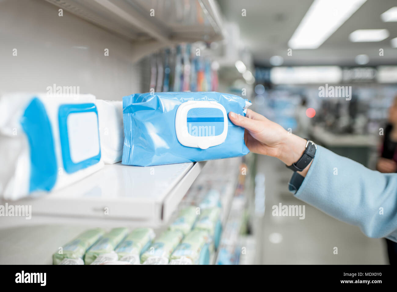 Taking packaging with wet wipes Stock Photo - Alamy