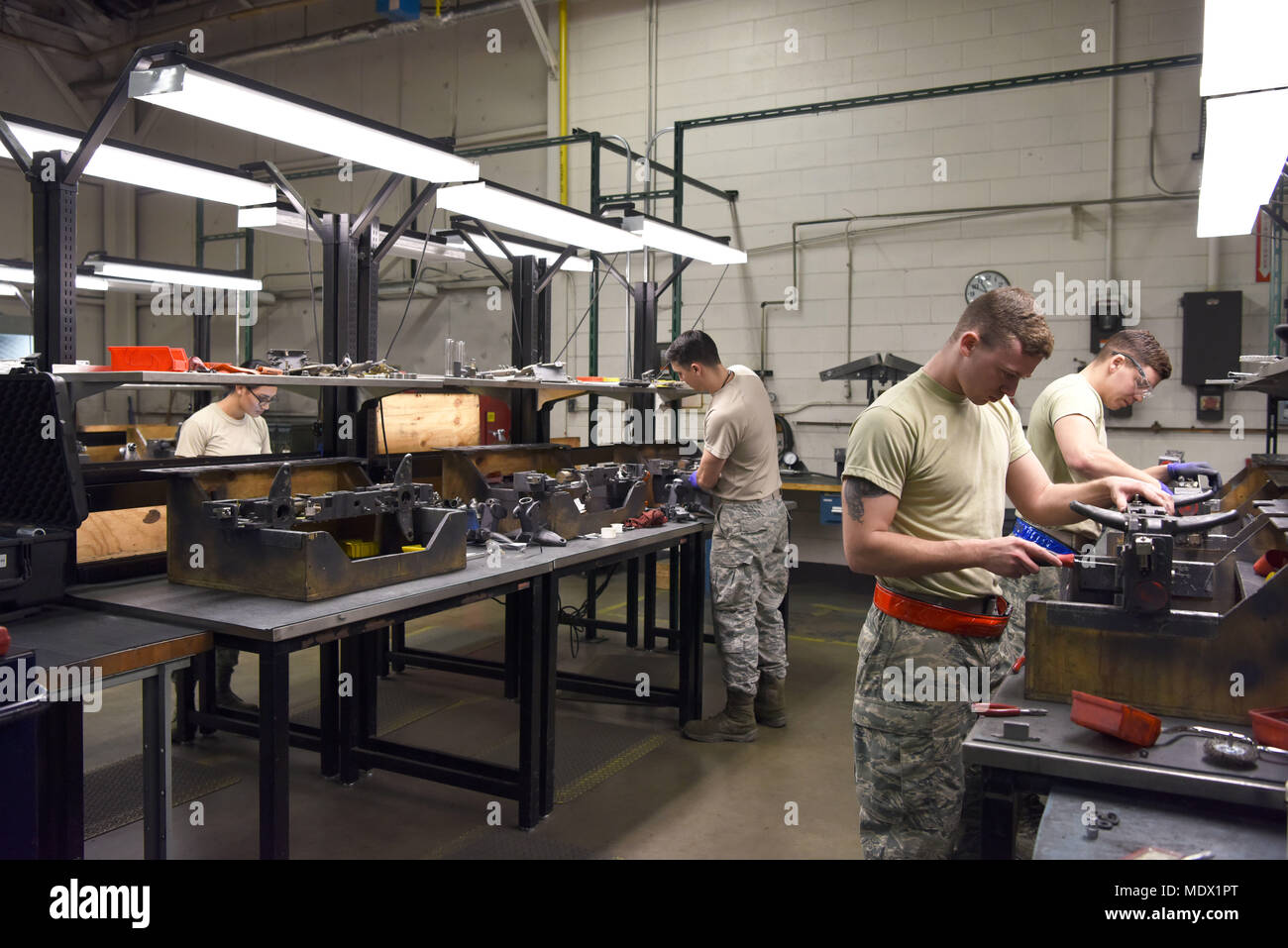 Airmen from the 5th Munitions Squadron maintain and repair various ...