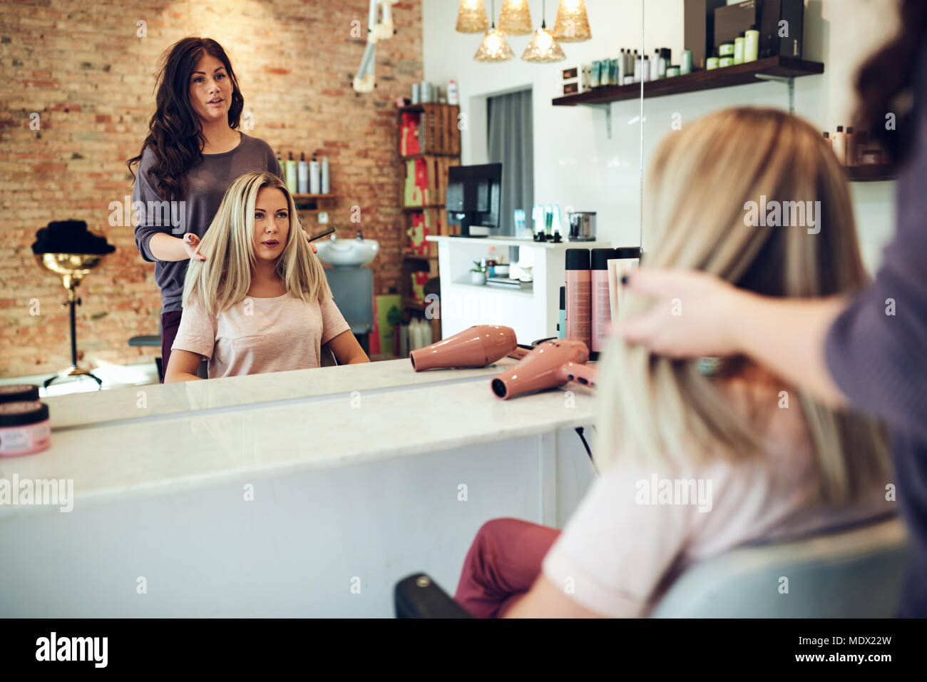 Woman having hair done hi-res stock photography and images - Alamy