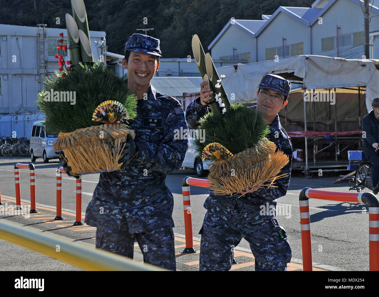 171214-N-DW433-047 YOKOSUKA, Japan (Dec. 14, 2017) – Members of the ...